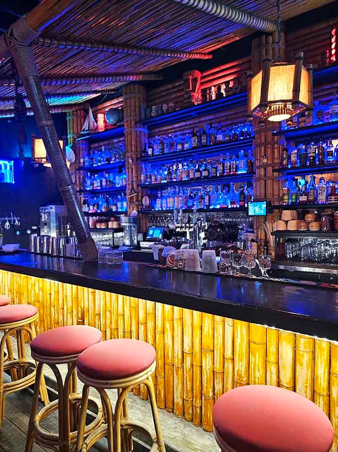 The bar glows like a beacon of rum-soaked hope in a world that sometimes needs exactly that.