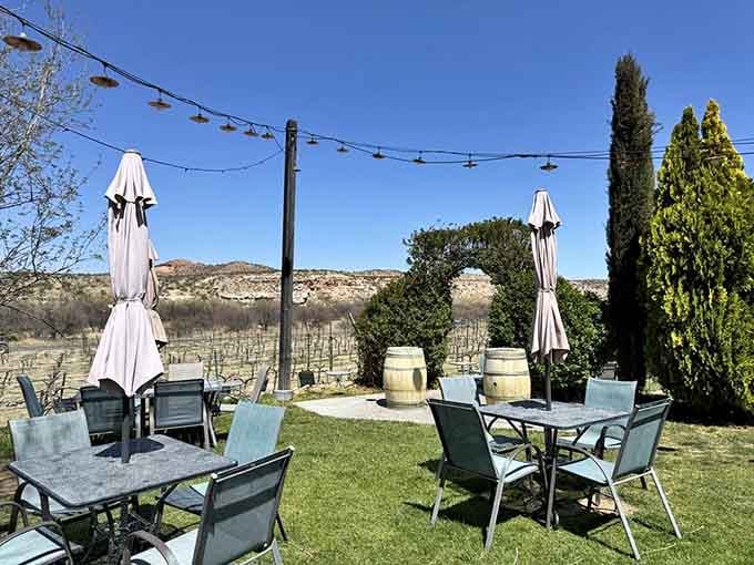String lights and barrel tables create an outdoor setting that's perfect for pretending you're vacationing in Tuscany.