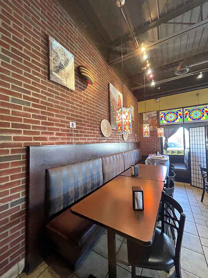 Brick walls and decorative touches blend industrial charm with Middle Eastern aesthetics in surprisingly harmonious fashion together.