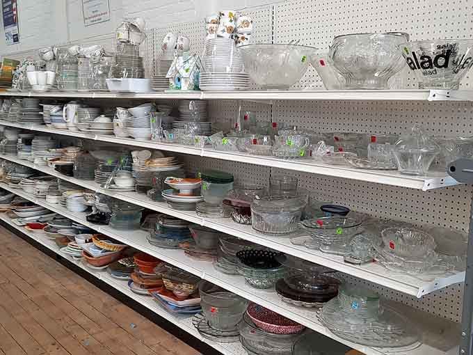 Glassware and dishes stacked high, perfect for hosting dinner parties without the fancy department store price tags attached.