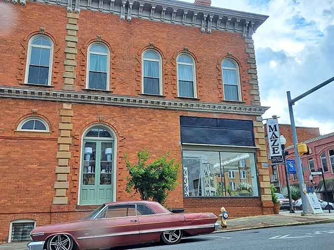 The Maze building shows off that gorgeous brick detailing and vintage car aesthetic that makes downtown Americus feel authentically preserved, not manufactured.