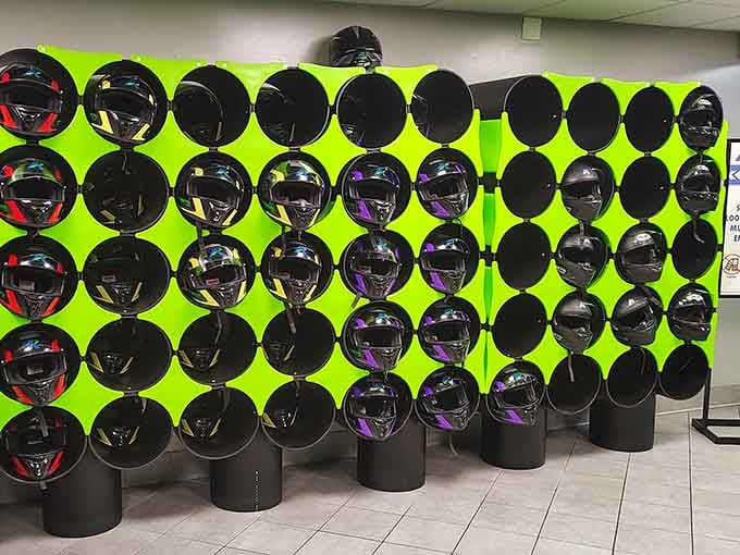 A wall of helmets ready for action&mdash;your chariot awaits, and safety never looked quite this organized.