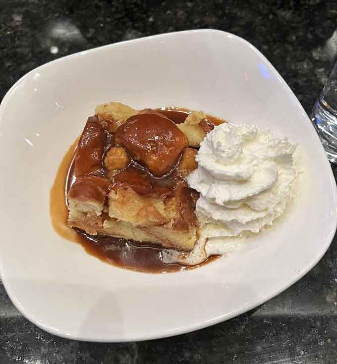Bread pudding with caramel sauce and whipped cream, the dessert equivalent of a warm blanket.