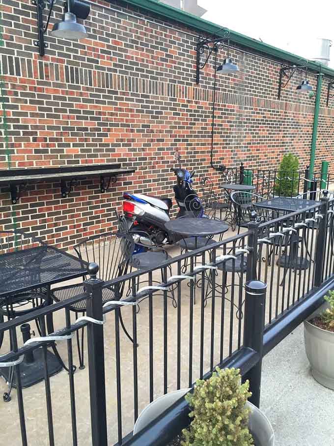 The inviting patio offers fresh air dining with brick charm, perfect for those gorgeous Missouri summer evenings.