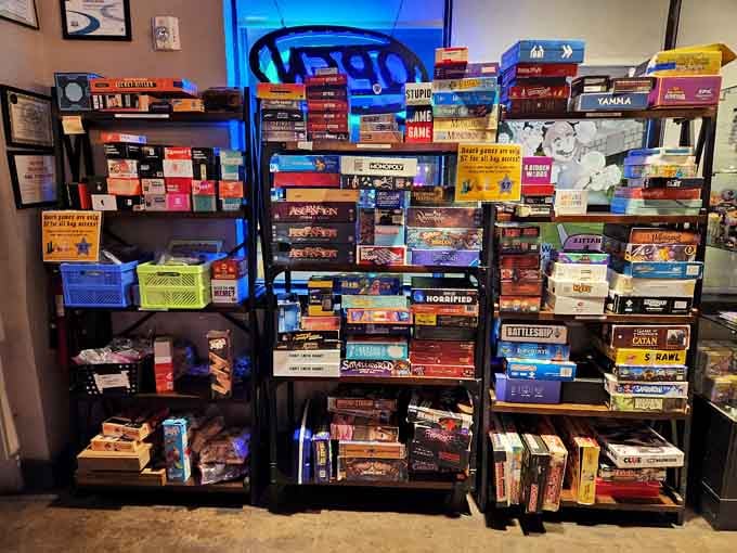 The board game library towers with options, from classic favorites to obscure titles you've never heard of.