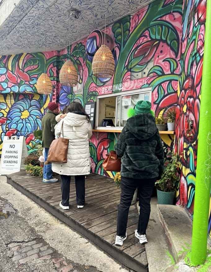 The universal stance of doughnut contemplation: studying options like they're choosing lottery numbers that actually pay off.