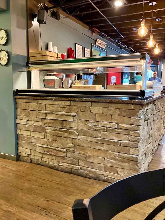 The stone-faced counter and open kitchen let you watch the magic happen, which somehow makes everything taste better.