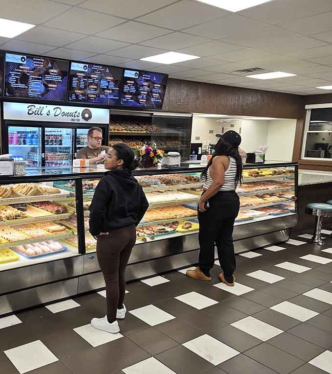 The hardest decision you'll make all day happens right here, staring at cases full of fried perfection.