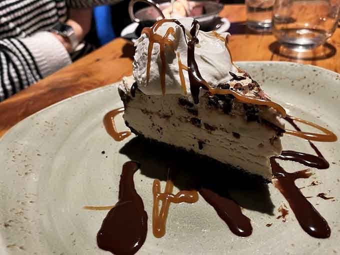 That towering slice of pie drizzled with chocolate and caramel sauce could make a grown person weep with joy.