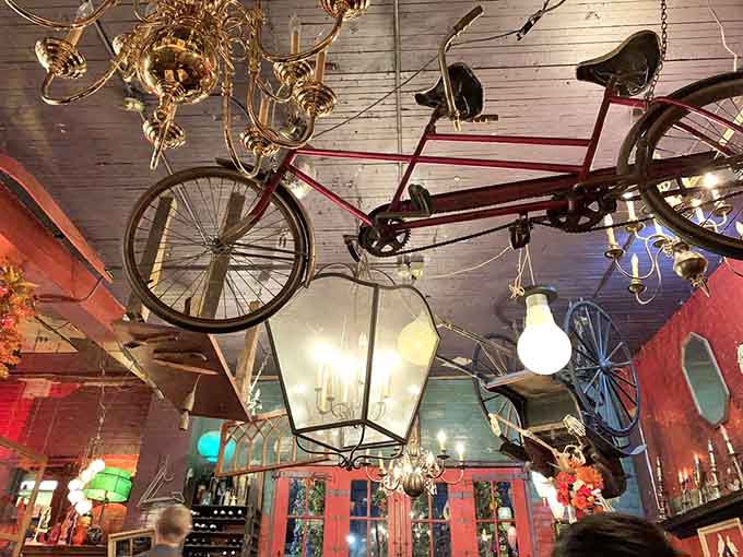 A tandem bicycle suspended among chandeliers proves that sometimes the best decor defies all logical explanation beautifully.