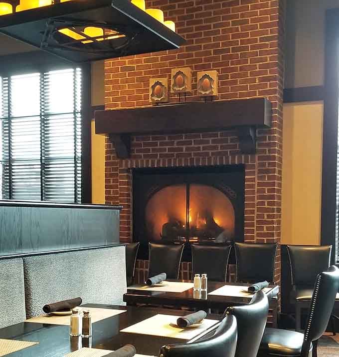 The brick fireplace becomes the focal point for romantic dinners when Missouri weather turns chilly outside those windows.