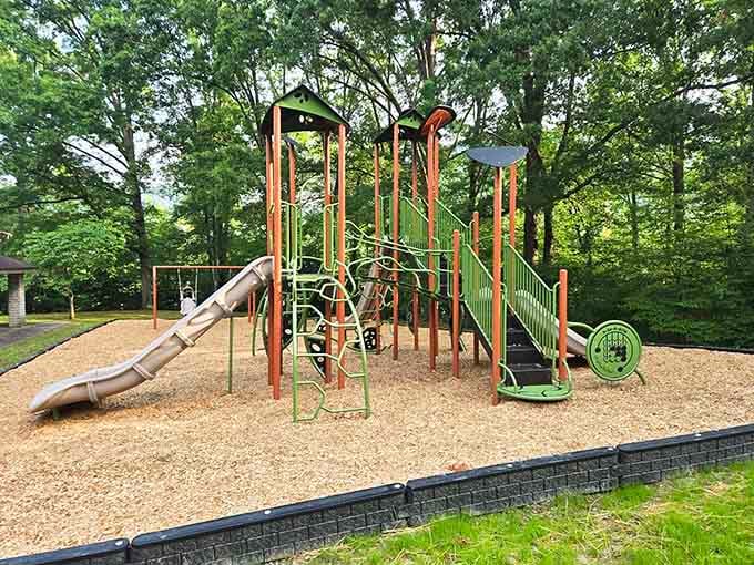 Modern playground equipment meets mountain backdrop, keeping the kids entertained while parents enjoy the scenery and peace.