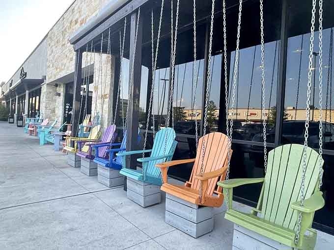 Colorful swing chairs outside offer the perfect spot to relax before or after your meal, beach-style.