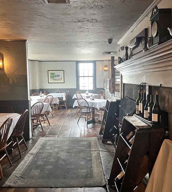 Wide-plank floors worn smooth by centuries of footsteps lead to dining spaces where history literally supports your dinner experience.