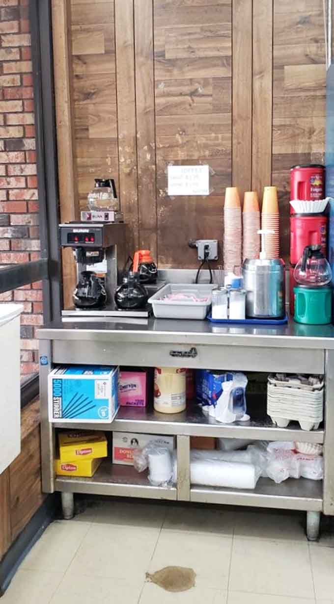 The coffee setup is straightforward and functional, designed to complement the donuts rather than compete with them for attention.