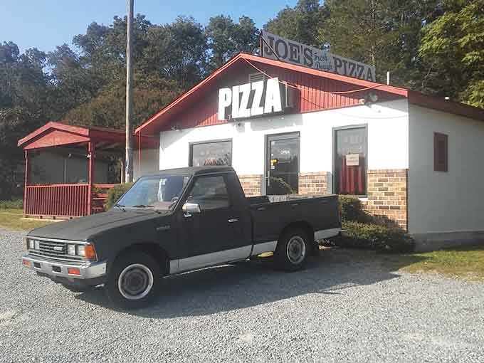 The humble parking lot where your journey to pizza paradise begins, just off Highway 72 in tiny Woodville.