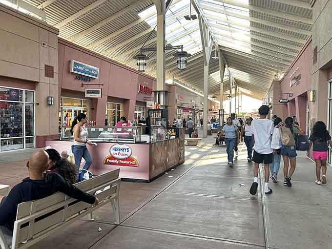 The covered walkways provide shade and shelter, proving that outlet shopping can be comfortable even when Illinois weather gets moody.