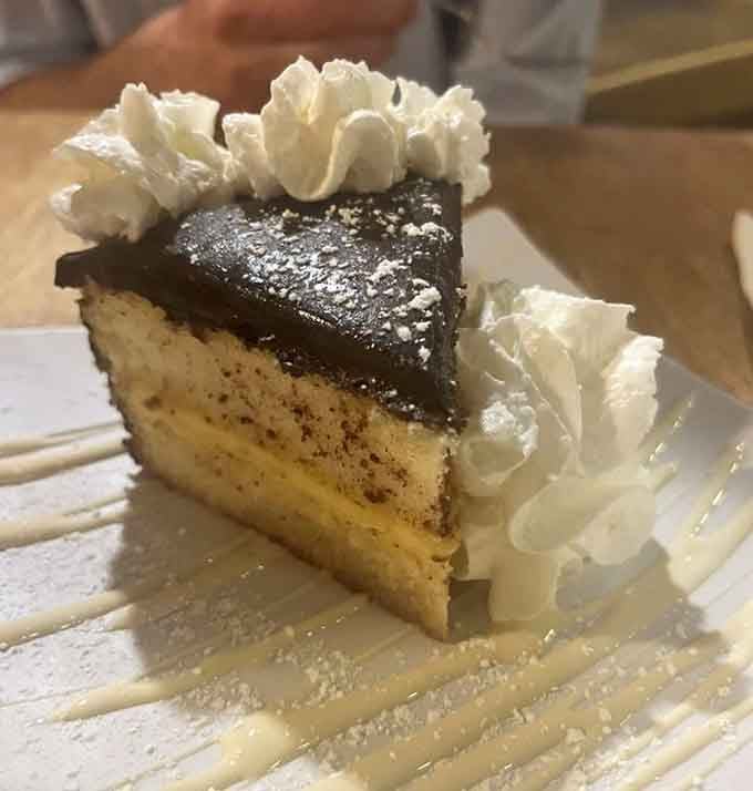 Boston cream pie with whipped cream rosettes, because even dessert gets the New England treatment at this Jupiter seafood sanctuary.