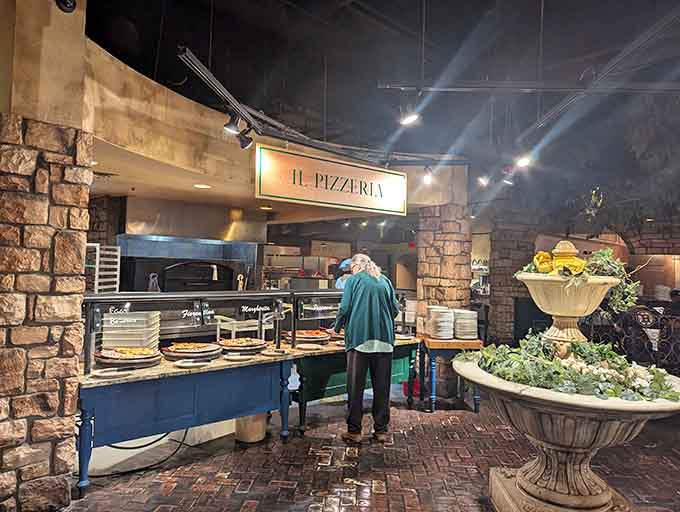 The pizza station's stone surround and stacked plates signal that fresh pies are coming out faster than you can say "seconds."
