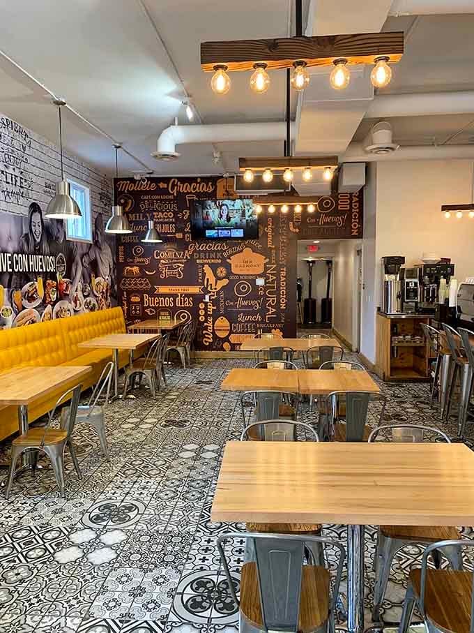 Exposed brick meets modern industrial lighting in a space designed for serious breakfast enjoyment.