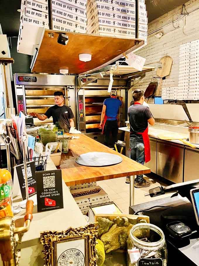 Behind the scenes, pizza makers work their magic with the kind of focus that produces consistently great pies.