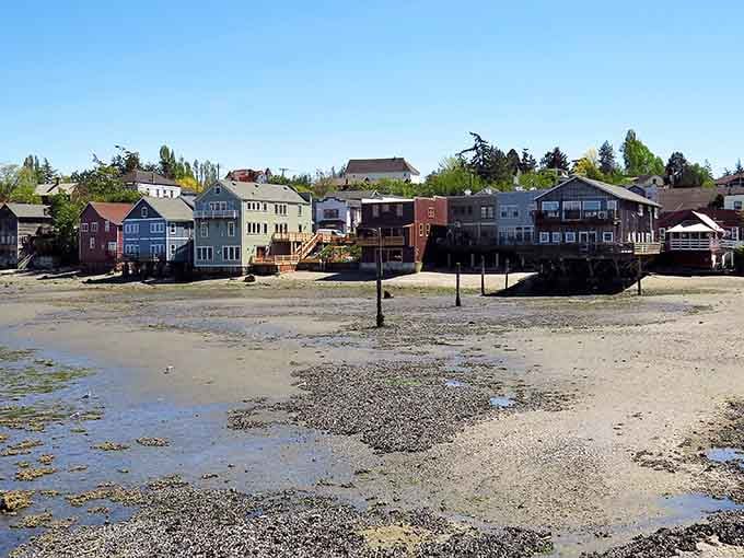 Colorful waterfront homes perched above the beach create a scene straight out of a coastal living fantasy come to life.