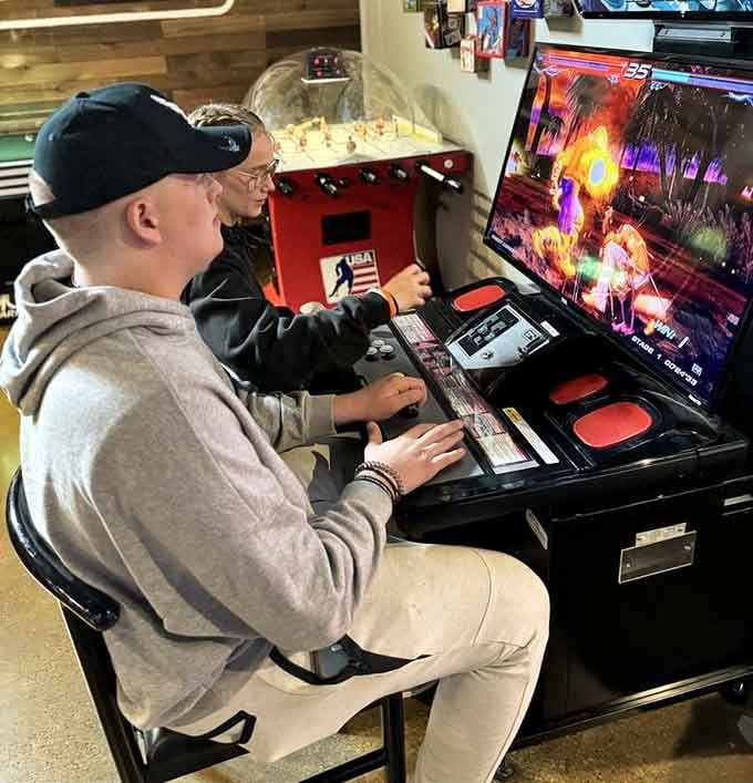 Two generations bonding over Tekken 6, proving that fighting games unite families better than most Thanksgiving dinners ever could.