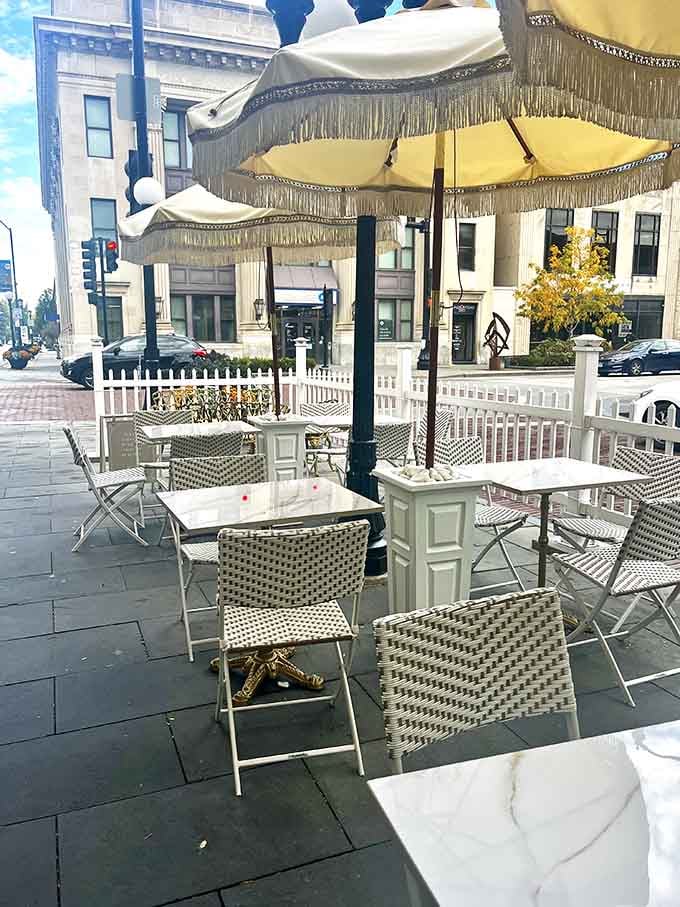 Outdoor seating with fringed umbrellas where you can pretend you're brunching in Paris while staying firmly in Illinois.