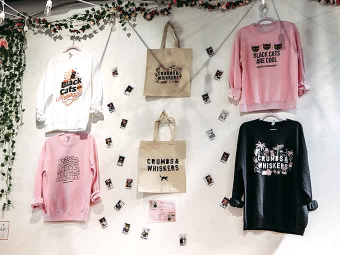 The merchandise wall tempts you with wearable declarations of your cat obsession, because subtlety is overrated anyway.