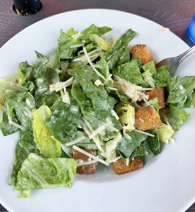 Even the salad looks happy here, dressed up and ready to make you feel virtuous between indulgences.