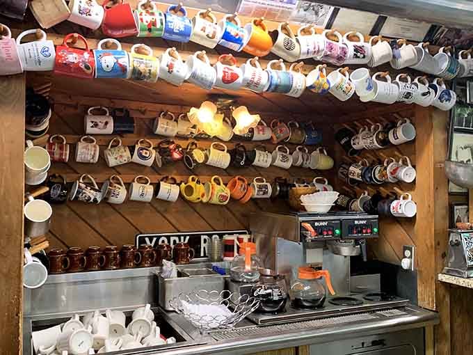 This impressive mug collection on display shows decades of coffee-fueled conversations and loyal patronage over the years.