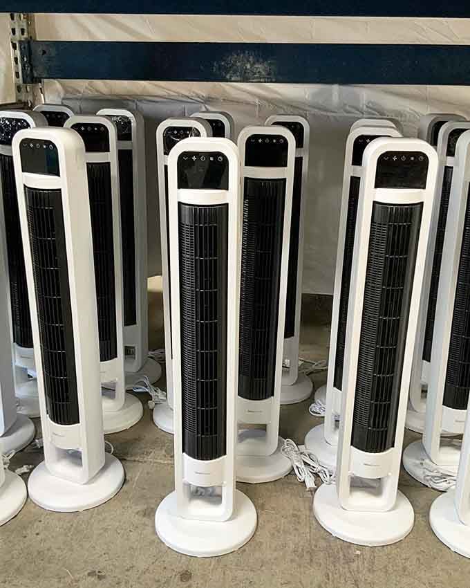 Tower fans lined up like soldiers ready to battle the heat without decimating your electricity bill or savings account.