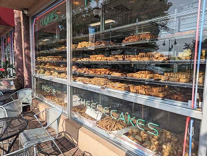 Window displays overflow with golden pastries catching afternoon light, basically daring you to walk past without stopping inside.