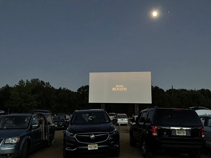 Under the moon and stars, the screen glows like a beacon for anyone seeking entertainment the old-fashioned way.