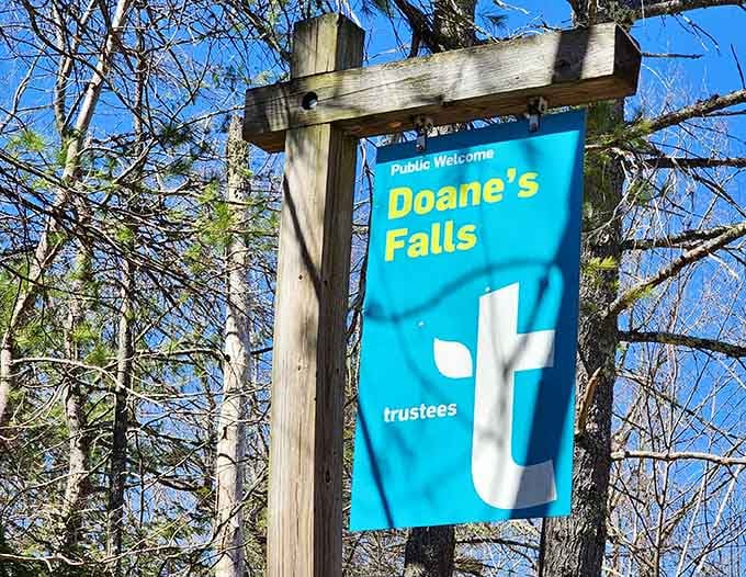 The cheerful welcome sign that marks the beginning of your waterfall adventure in Royalston.