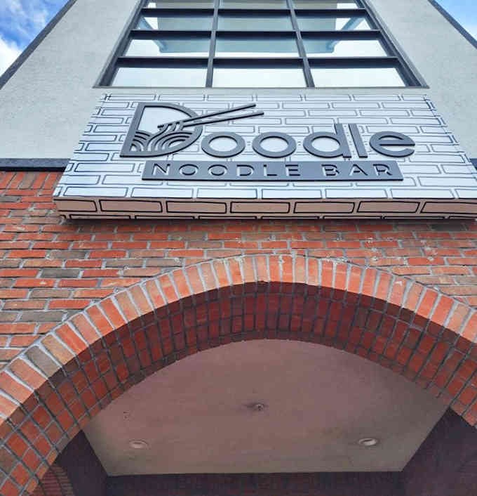 The signage outside announces you've arrived at the intersection of art, noodles, and pure creative genius unleashed.