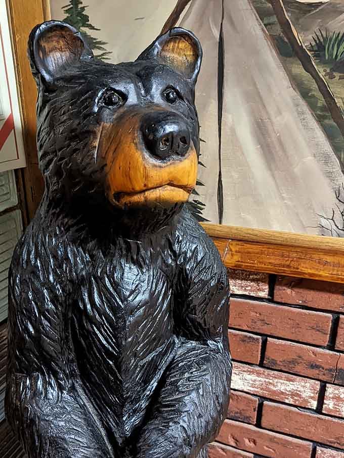 This friendly bear statue greets guests with a smile, standing guard over Northwoods hospitality done absolutely right.