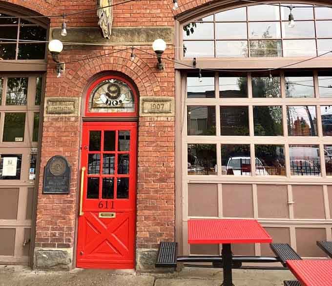 The 1907 entrance still welcomes visitors, though now they're arriving for burgers instead of racing toward fires.