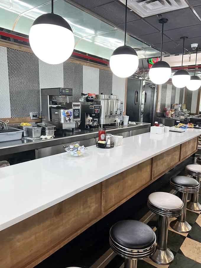 The counter gleams with possibility, where milkshake dreams are crafted by people who clearly love their work immensely.