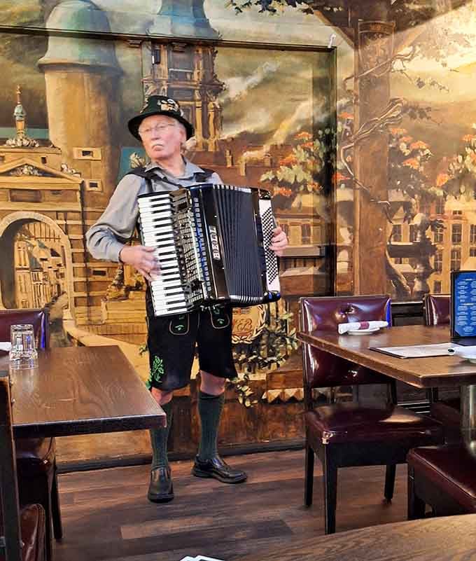 Live accordion music fills the air, because a German restaurant without polka is just a restaurant with sauerkraut.