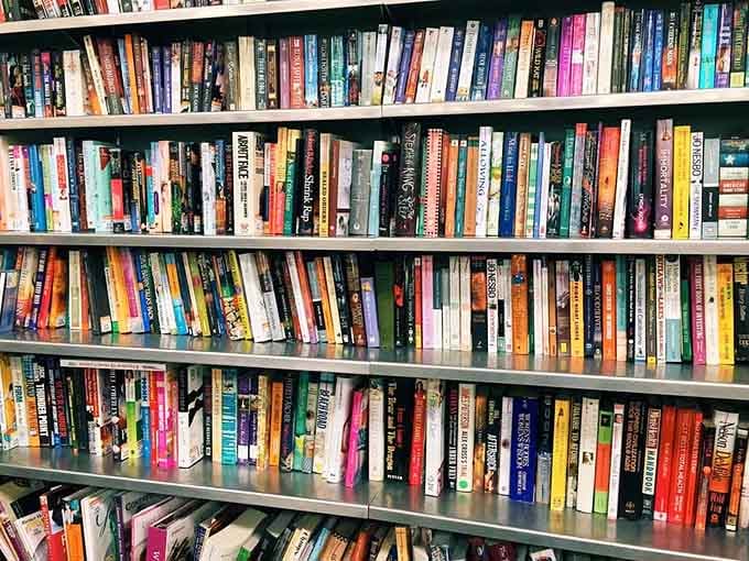 Books lined up like a library where everything costs pocket change instead of late fees and judgmental librarians.