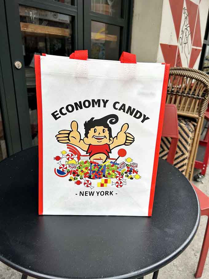 The cheerful mascot on their tote bag perfectly captures the unbridled enthusiasm everyone feels inside here.