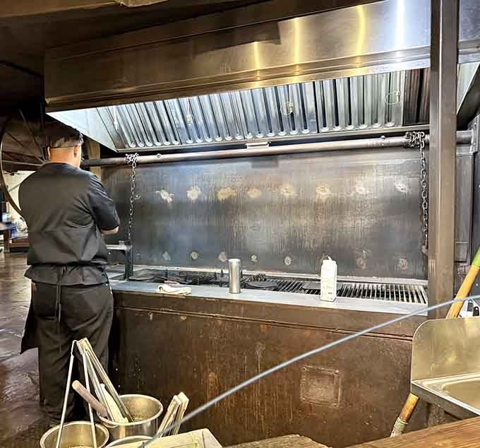 Behind the scenes, that massive mesquite grill works overtime creating the smoky perfection you're about to devour.