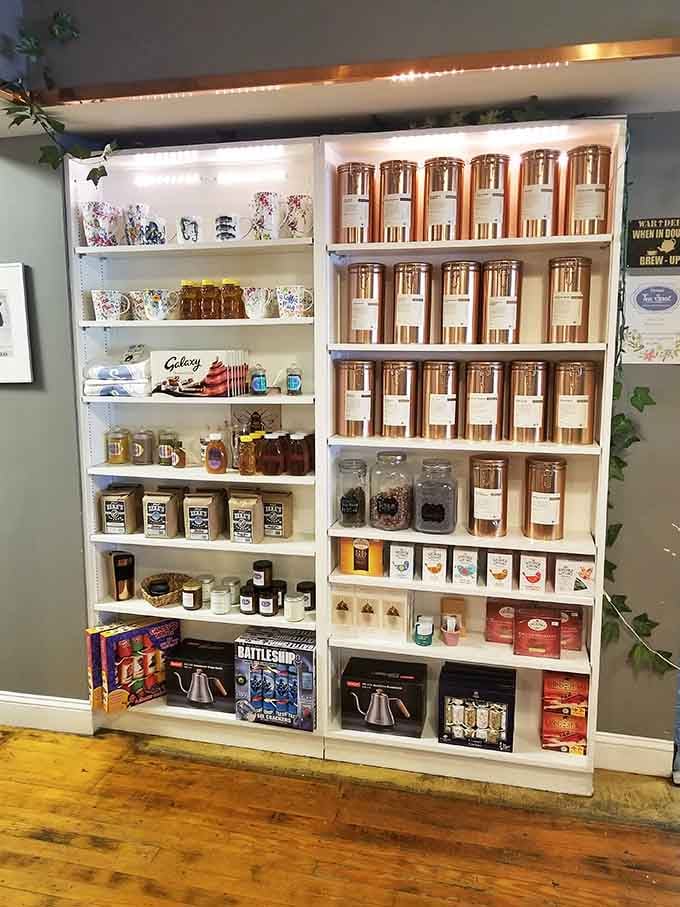 Copper tea tins and British treats line the shelves, tempting you to stock your pantry with proper tea essentials.