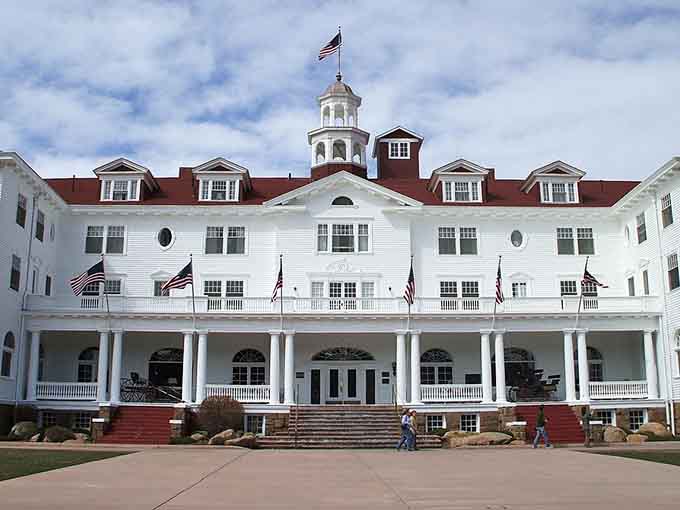 The Stanley Hotel stands grand and white, looking exactly like the kind of place that inspired a horror novel.