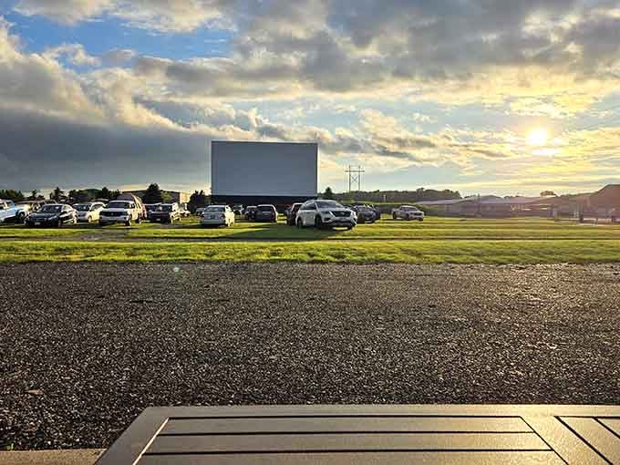 Folks gather on the grass, claiming their spots for an evening of entertainment under Wisconsin's open skies.