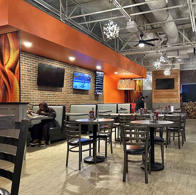 Comfortable seating and warm orange walls create the perfect atmosphere for serious burger consumption and zero judgment from anyone.