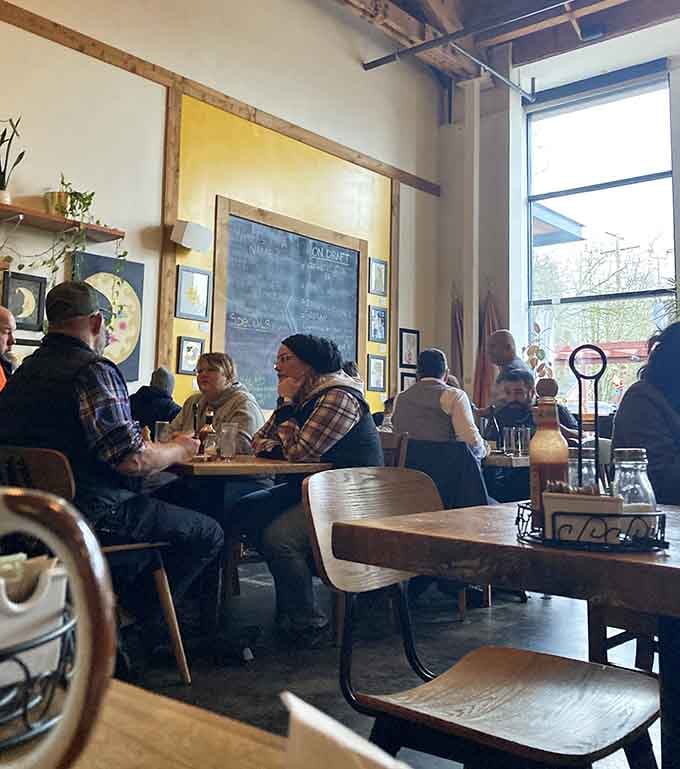 Tables full of people doing what Portlanders do best: eating, drinking, and enjoying life without unnecessary formality.