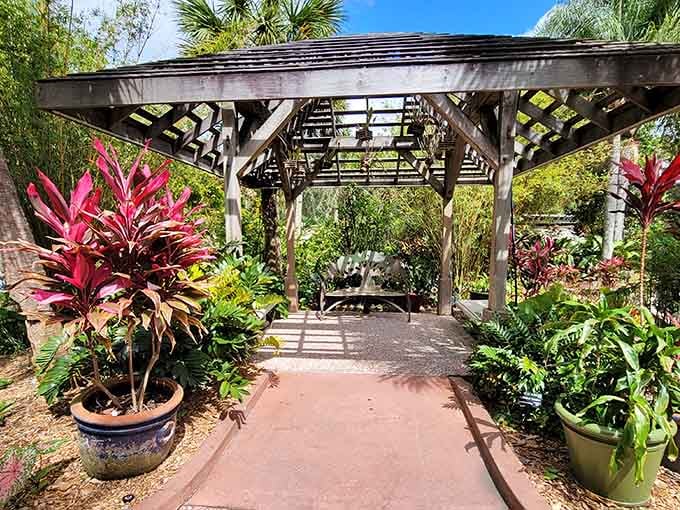 Garden pergolas provide shaded sanctuaries surrounded by potted tropical plants in every direction you look around.