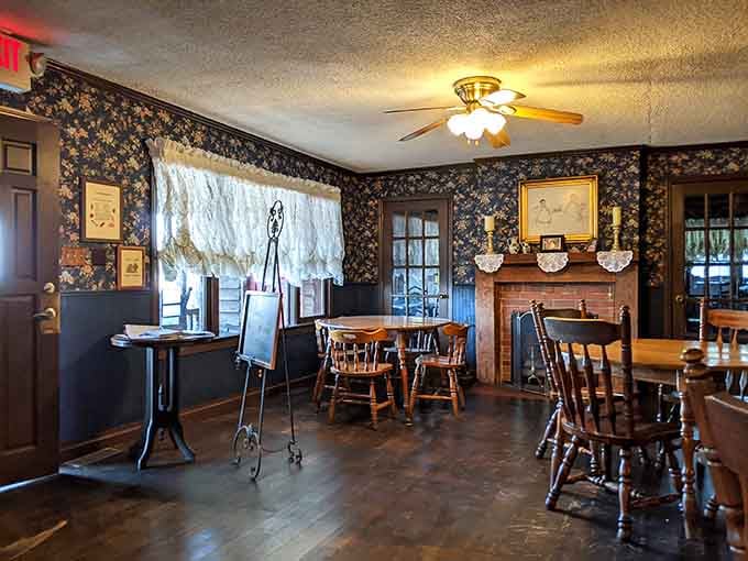 Floral wallpaper and wooden furniture create an atmosphere that feels like Sunday dinner at the house of your favorite relative.